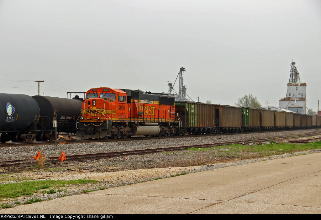 BNSF 9986 shoves on a coal load.